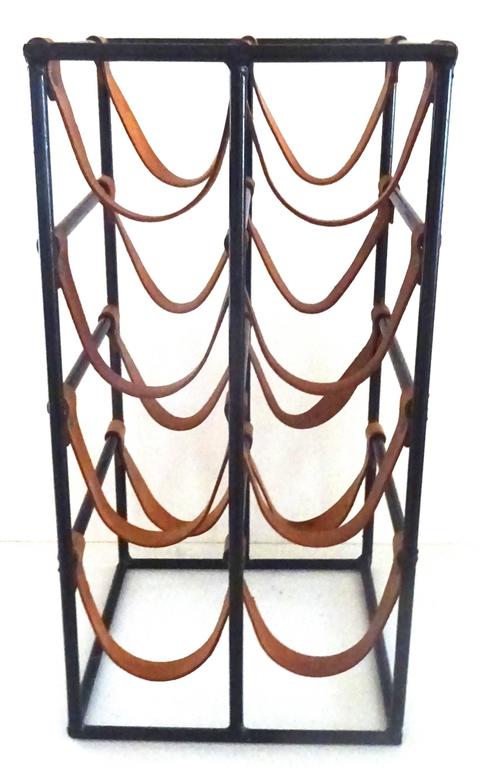 Modernist 1950s Arthur Umanoff Iron and Leather Wine Rack at 1stDibs