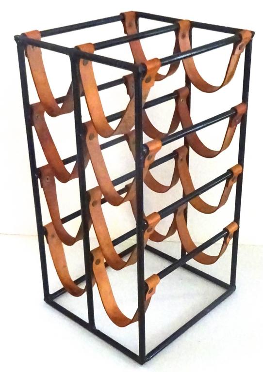 Modernist 1950s Arthur Umanoff Iron and Leather Wine Rack at 1stDibs