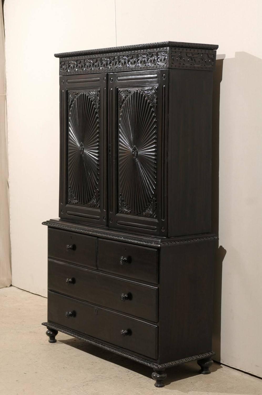 Richly Carved Shiny Black British Colonial Cabinet with Oval Pattern on ...