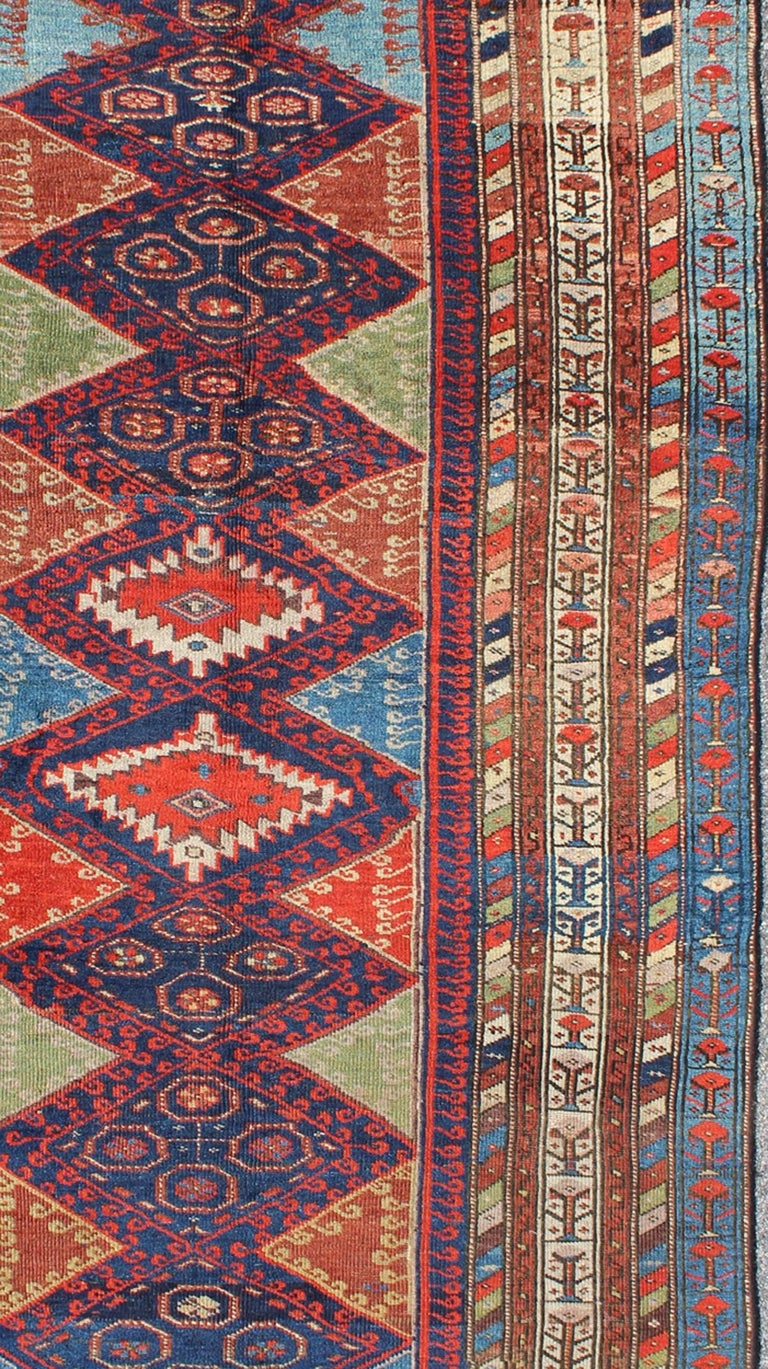 Antique Kurdish Kazak with Tribal and Geometric Motifs In Blue, red and ...