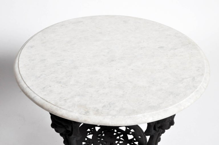 Round Table with Iron Legs and Marble Top at 1stDibs