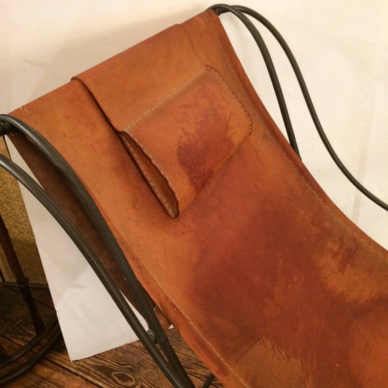 Super Cool Sling Back Distressed Leather and Iron Rocking Chair at 1stDibs