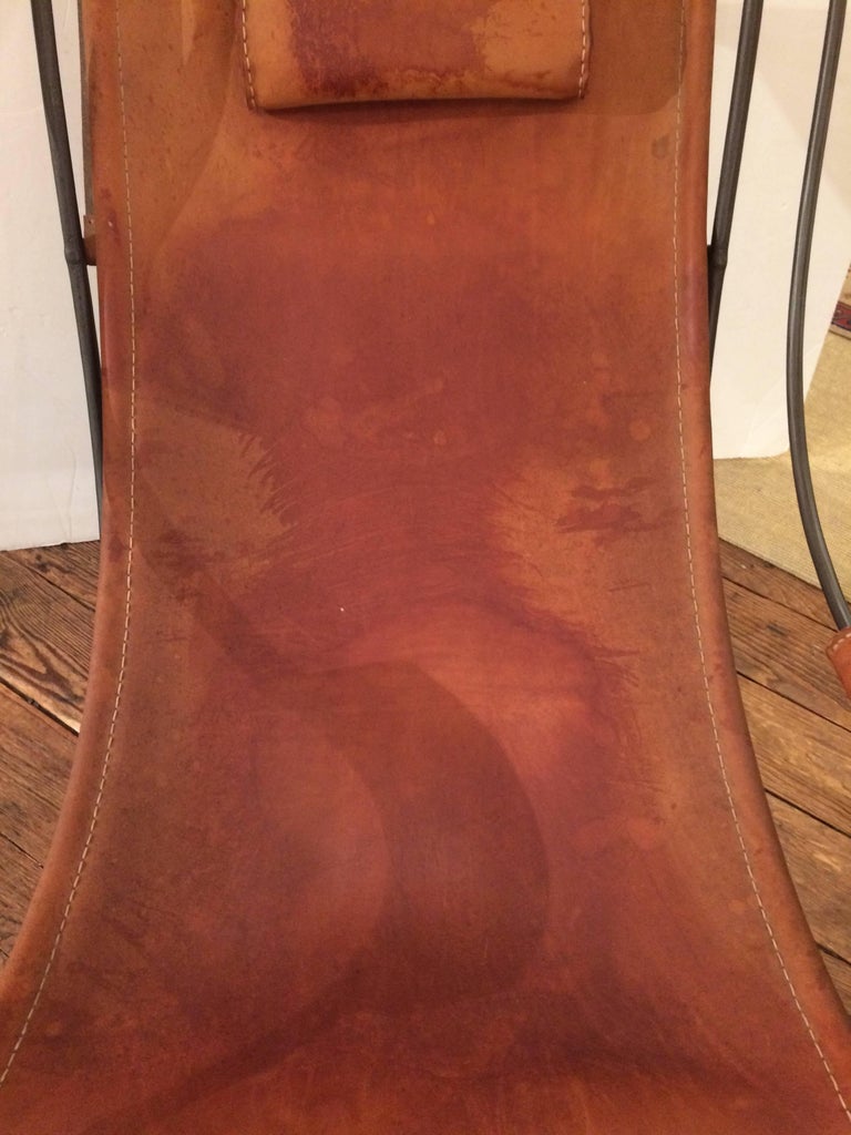 Super Cool Sling Back Distressed Leather and Iron Rocking Chair at 1stDibs