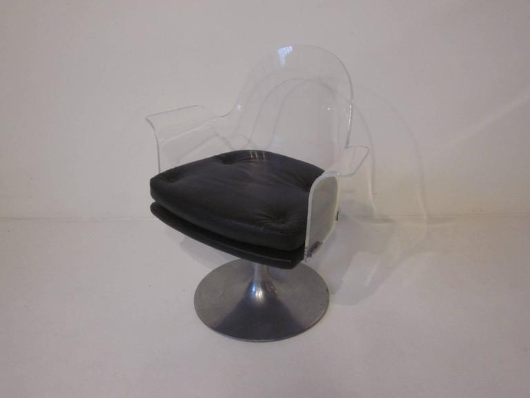 Tulip Based Lucite Upholstered Swiveling Armchair in the style of ...
