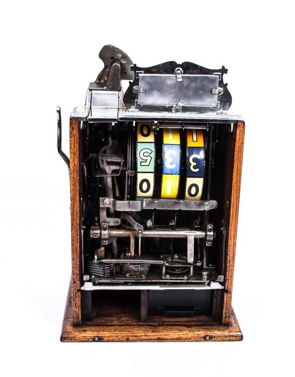 Antique 1920s Deco Poinsettia Slot Machine Mills Novelty Co at 1stDibs