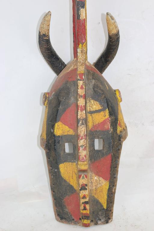 Powerful Tall Wood African Carved Pigmented Mask For Sale at 1stDibs