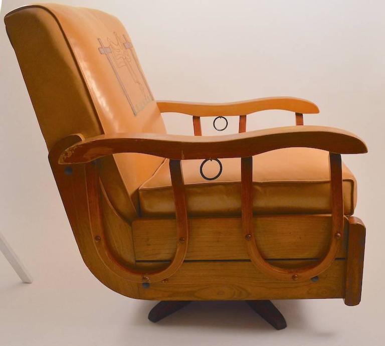 Cowboy Oak Swivel Tilt Rocking Lounge Chair at 1stDibs