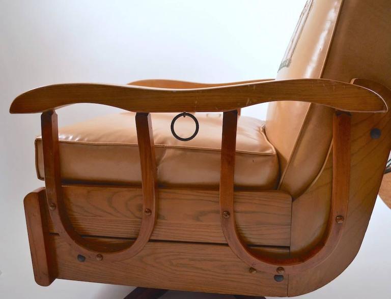 Cowboy Oak Swivel Tilt Rocking Lounge Chair at 1stDibs