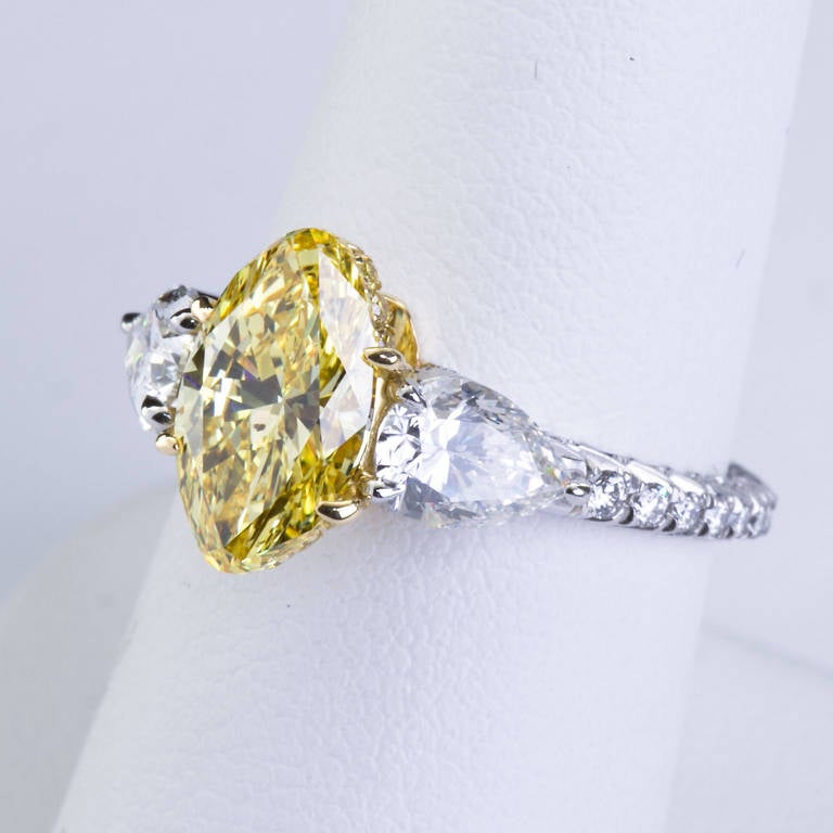 Fancy Vivid Yellow 1.80 carat Oval Diamond Engagement Ring at 1stDibs