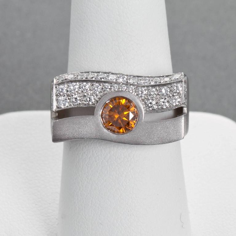 Fancy Deep Yellowish Diamond in Modern Wave Gold Ring GIA Certified 0. ...