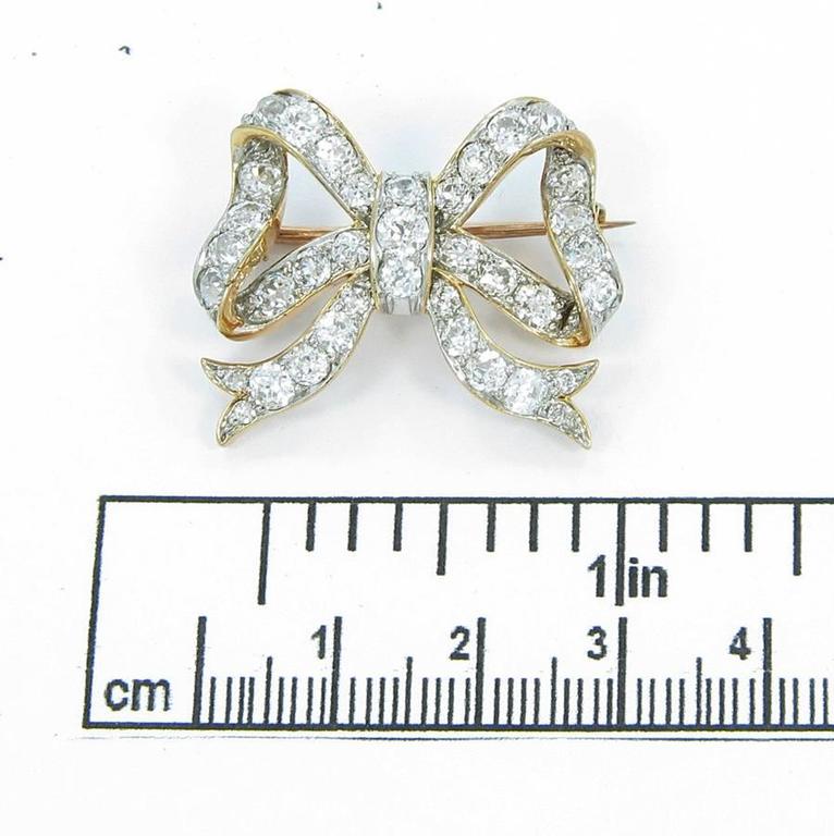 C&Co. Diamond Gold Platinum Bow Pin For Sale at 1stDibs