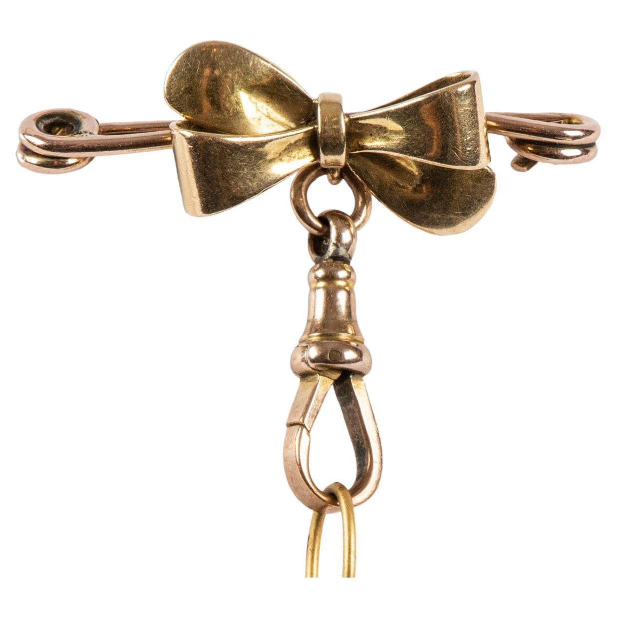 Victorian 18k Gold Bow-shaped Watch Pin, 19th Century For Sale at 1stDibs