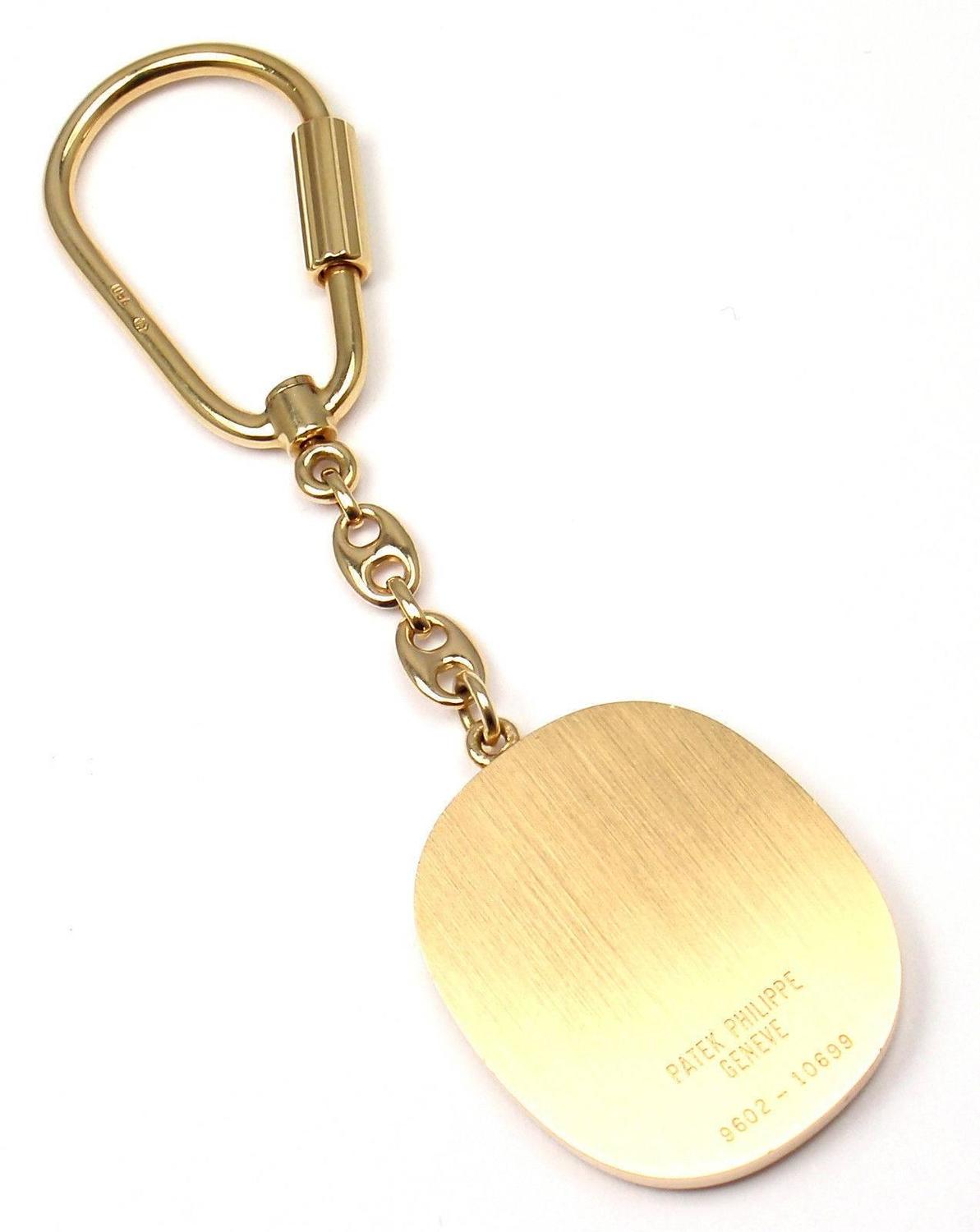 Patek Philippe Ellipse D'or Blue Sunburst Gold Key Chain For Sale at ...