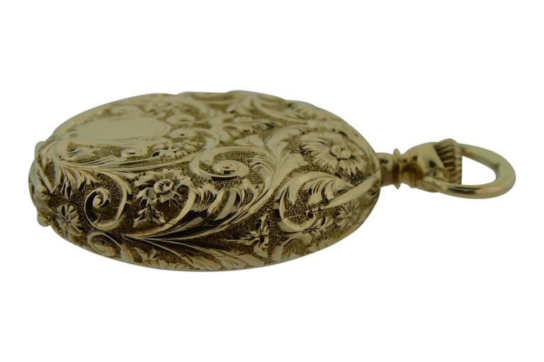 Omega Ladies Yellow Gold Repousse Pendant Watch at 1stDibs