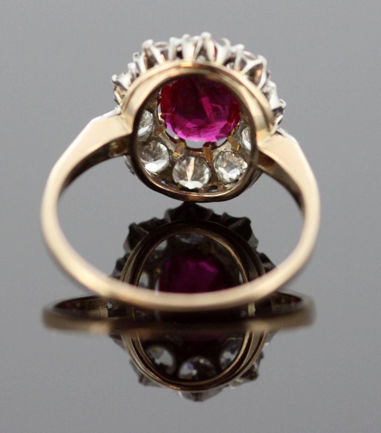 18 Karat Yellow Gold Oval Ruby Diamond Cluster Ring, circa 1970s at 1stDibs