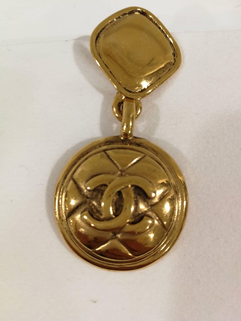 Chanel Gold tone rhombus CC logo pendant clip-on earrings at 1stDibs