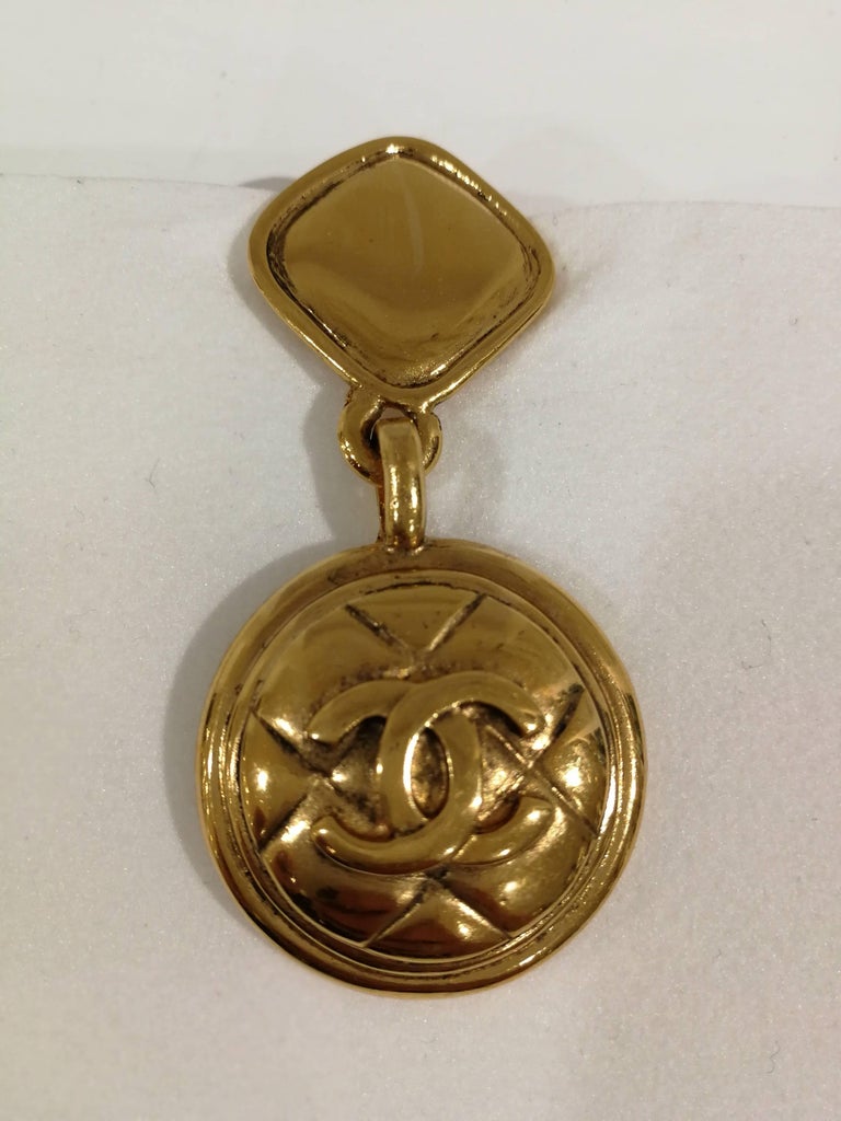 Chanel Gold tone rhombus CC logo pendant clip-on earrings at 1stDibs