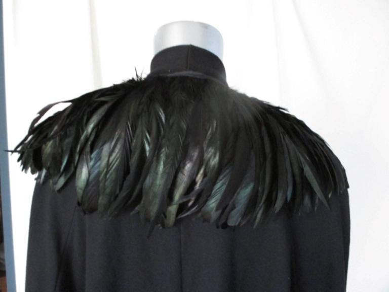 black draped evening jacket with an Iridescent feathers collar at 1stDibs