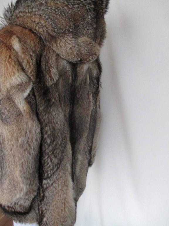 Rustic wolf hooded fur jacket at 1stdibs