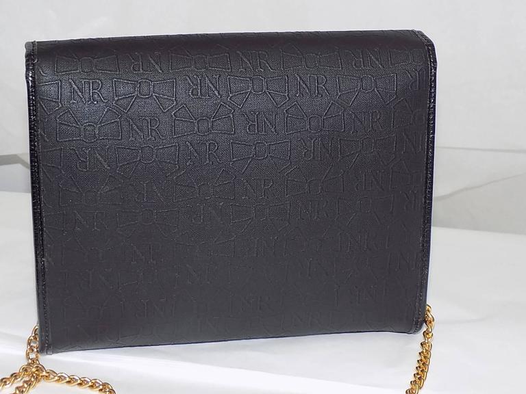 Nina Ricci black coated canvaswith gold chain bag / clutch For Sale at ...