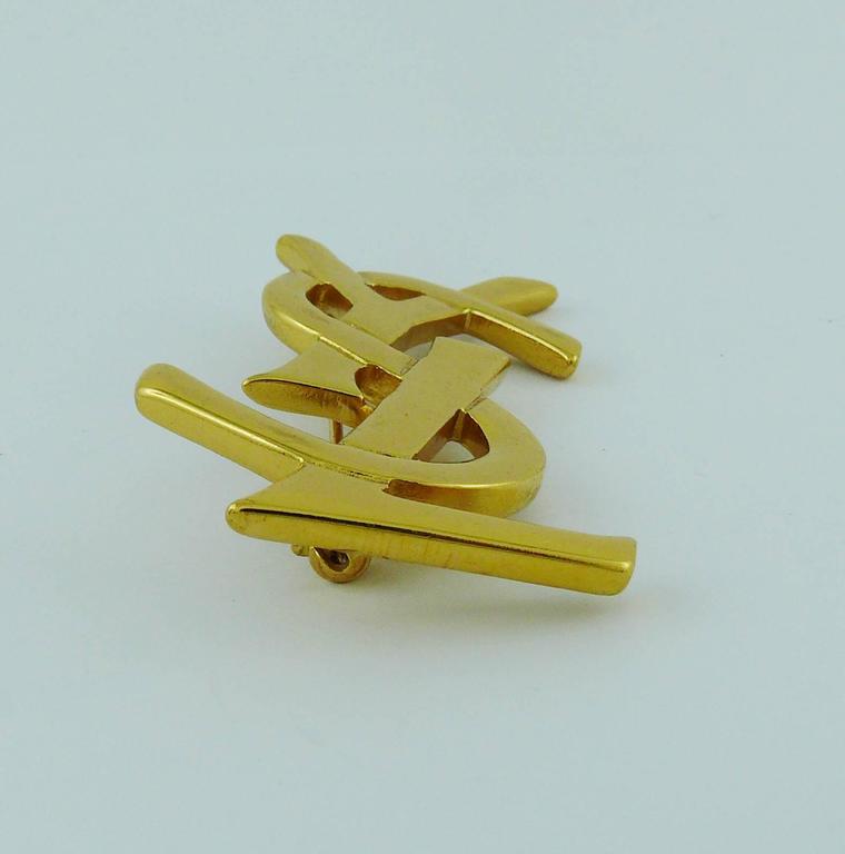Yves Saint Laurent YSL Gold Toned Logo Brooch For Sale at 1stdibs