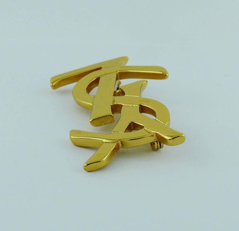 Yves Saint Laurent YSL Gold Toned Logo Brooch For Sale at 1stdibs