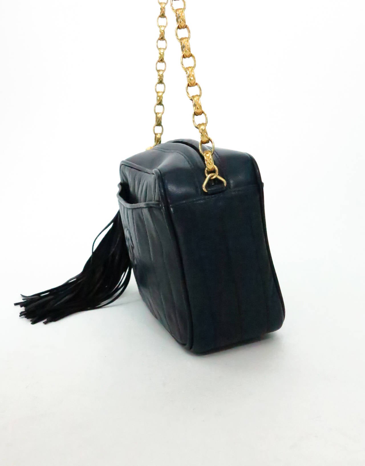 1980s Chanel navy blue lambskin camera bag with tassel at 1stDibs