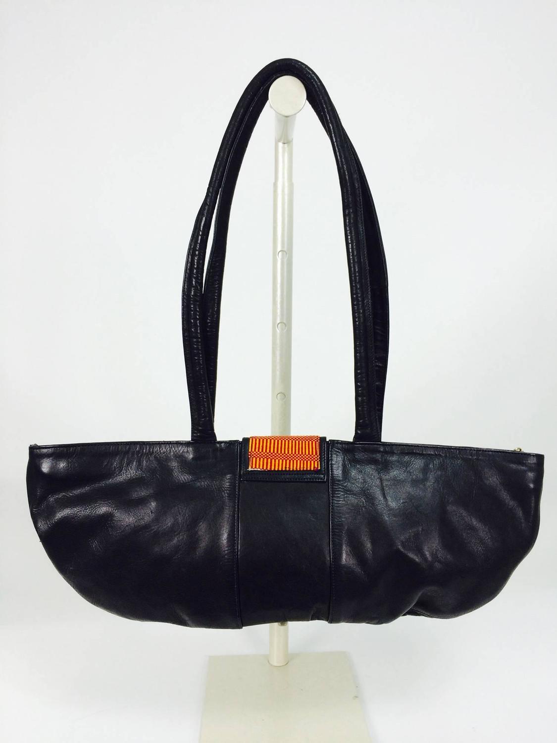 Novelty black leather unique shape tribal charm handbag at 1stdibs