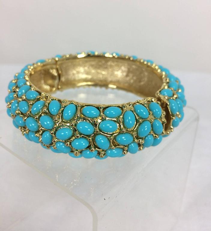 Kenneth Lane turquoise cabochon encrusted gold clamper bracelet at 1stDibs