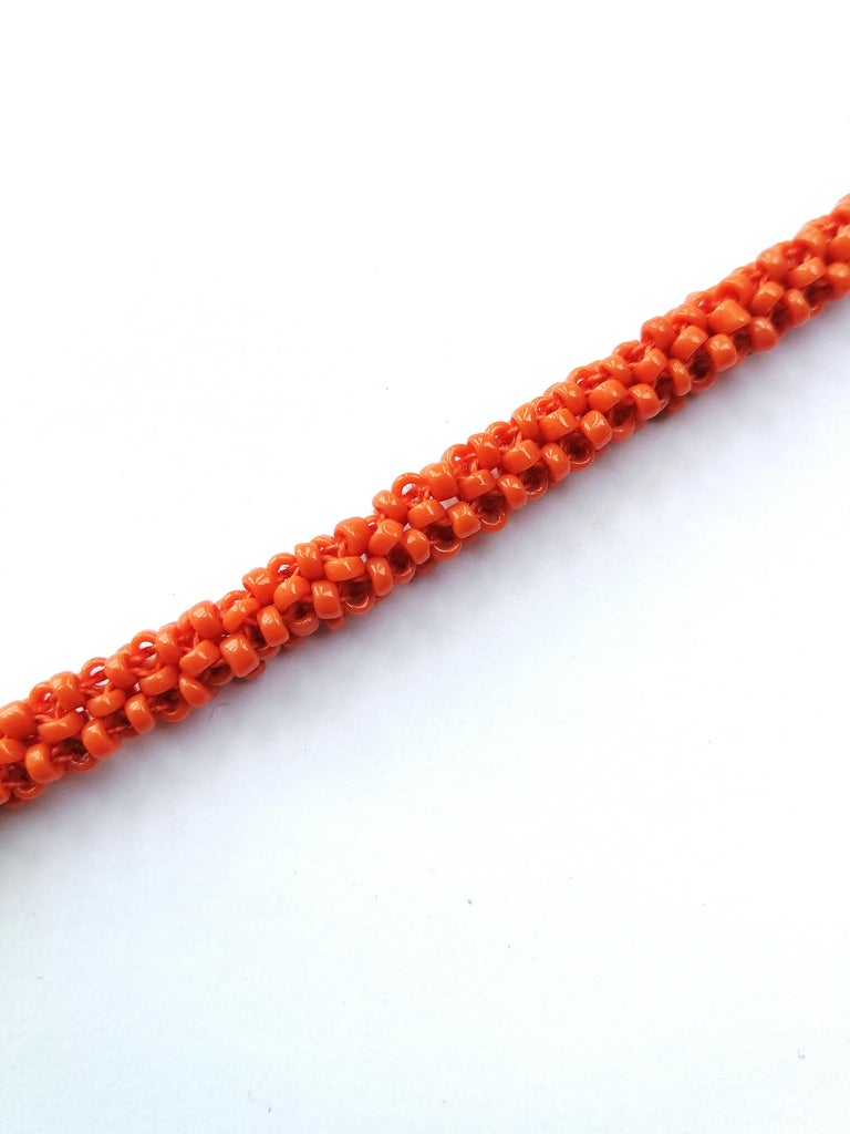 'Coral' glass bead, paste and faceted glass sautoir, French, 1920s. For ...