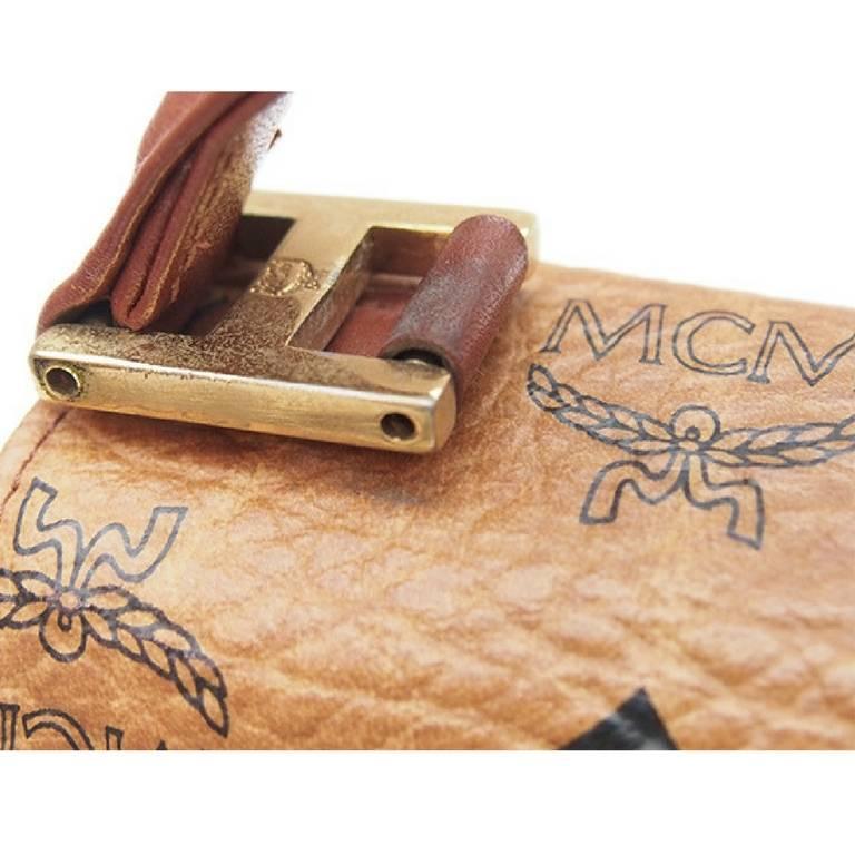 Vintage MCM classic brown mini kelly bag with key, designed by Michael ...