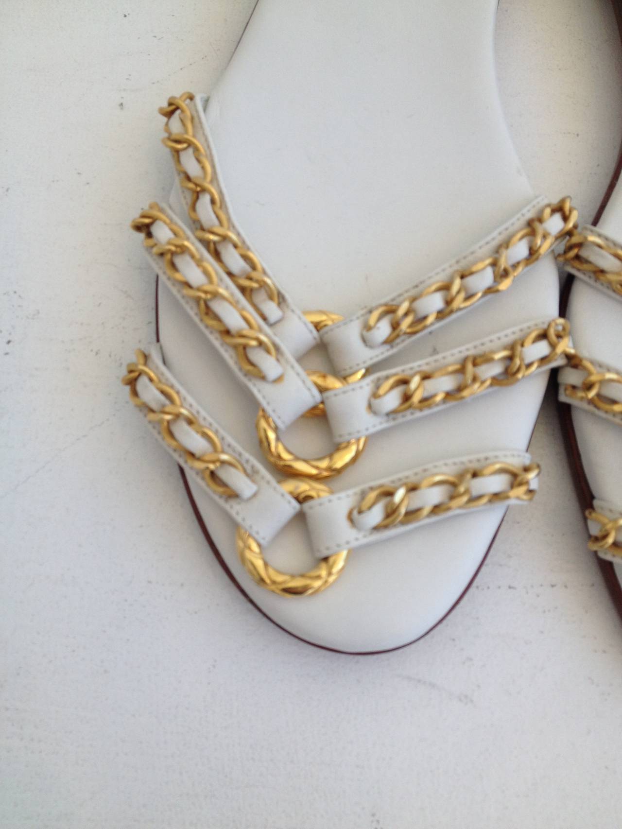 Chanel White Slides with Gold Chain at 1stDibs