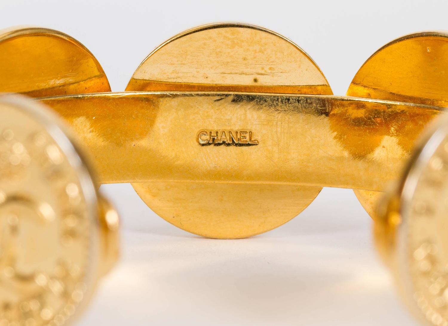 1980s Chanel Gold Coin Logo Cuff Bracelet For Sale at 1stdibs