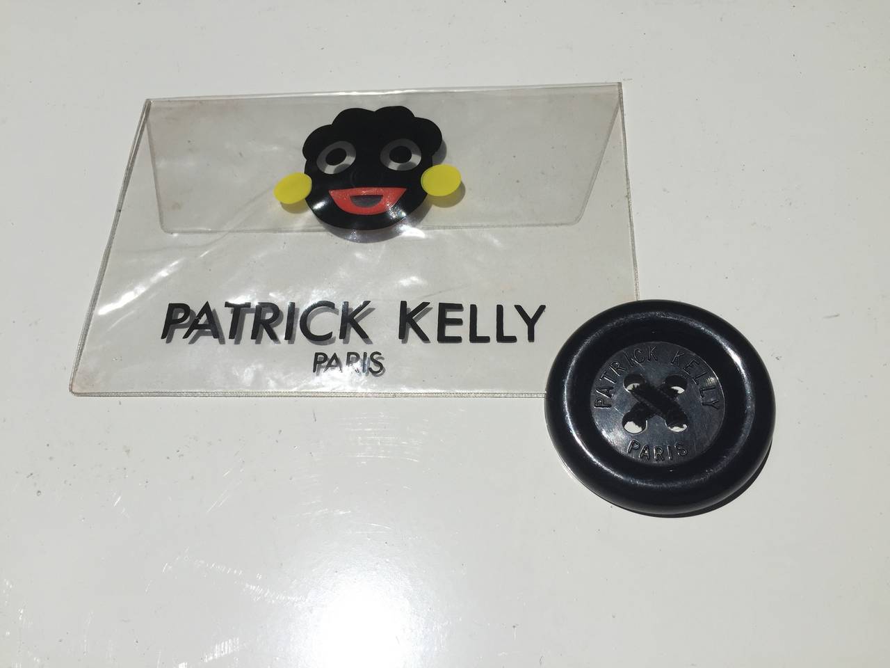 Patrick Kelly Paris black button pin / brooch. at 1stDibs