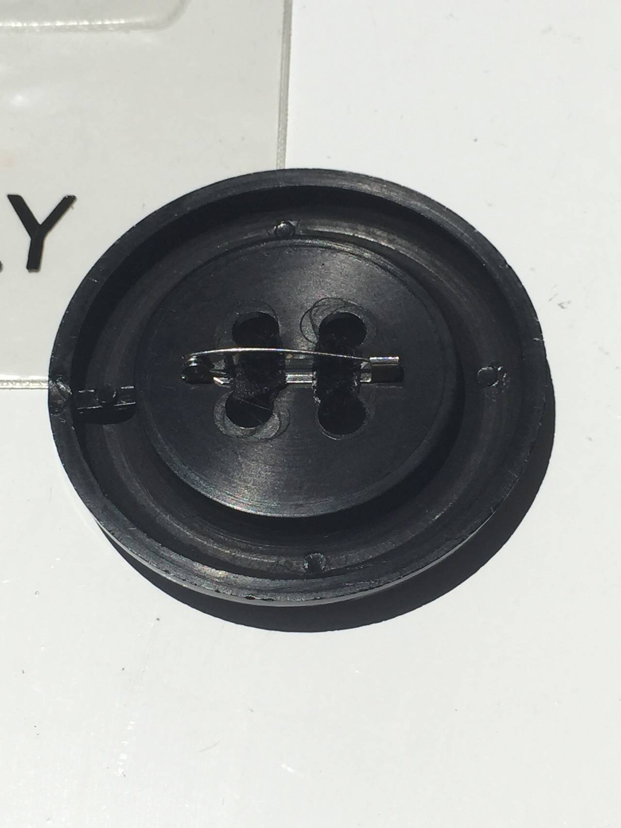 Patrick Kelly Paris black button pin / brooch. at 1stDibs