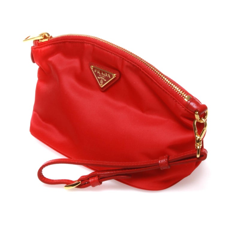 Prada small red clutch with gold hardware and red leather strap at ...