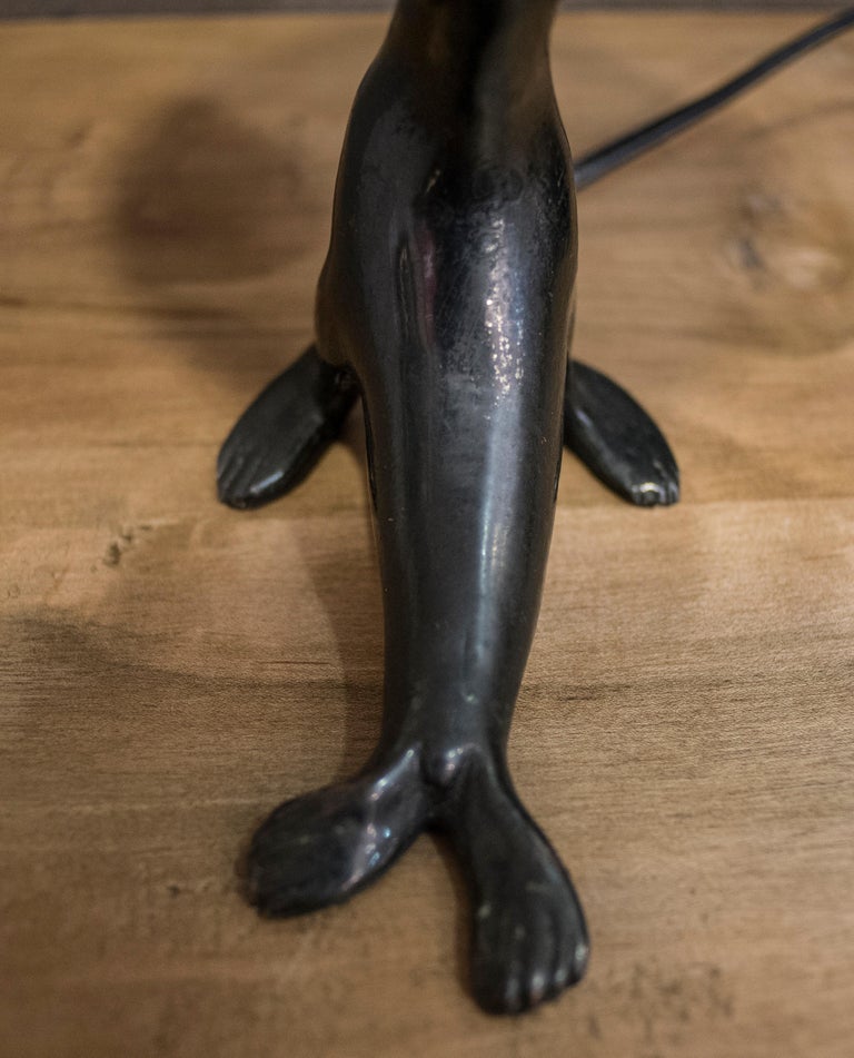 Art Deco Bronze Seal Figure and Glass Globe Table Lamp at 1stDibs