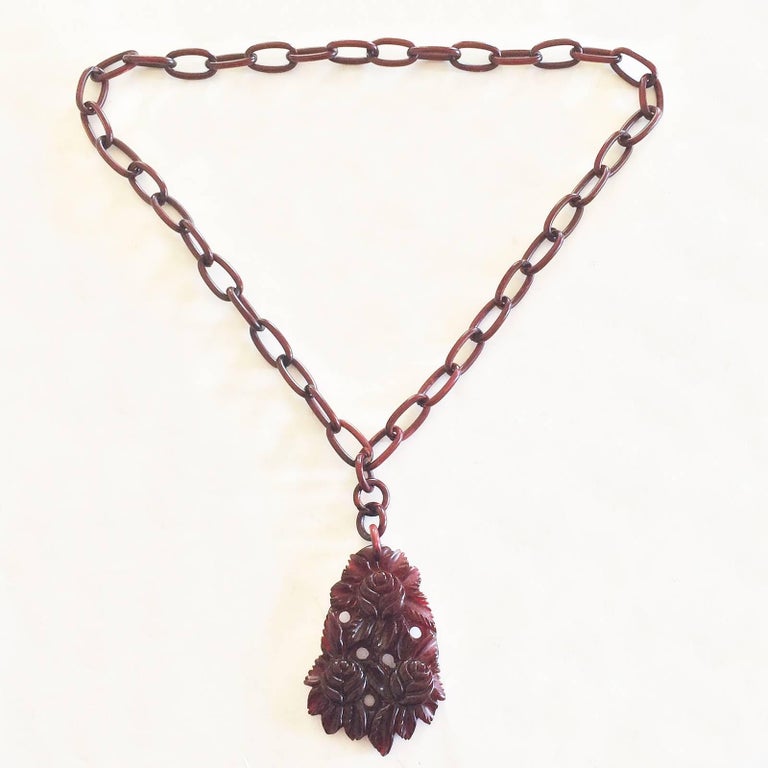 Art Deco Cherry amber red bakelite heavily carved necklace pendant at ...