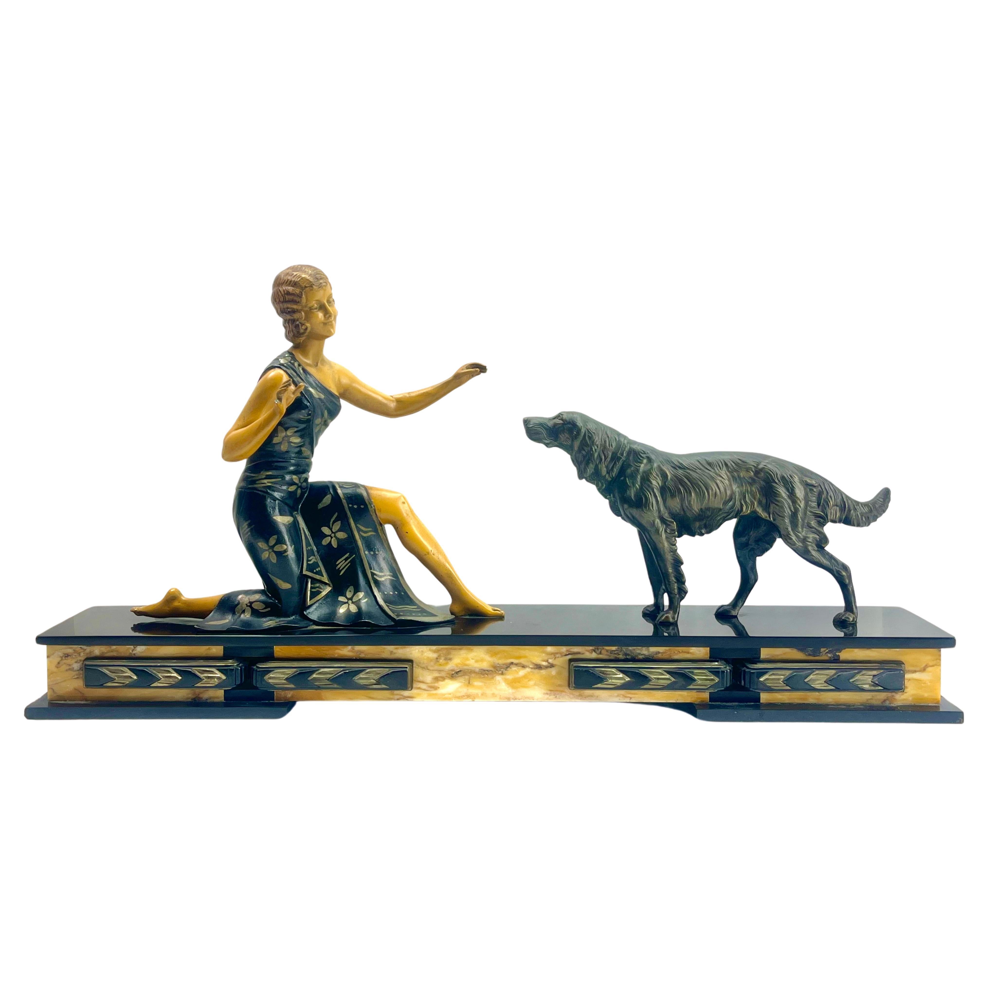 Art Deco with stylized Spelter Representation of Dog and Women on ...