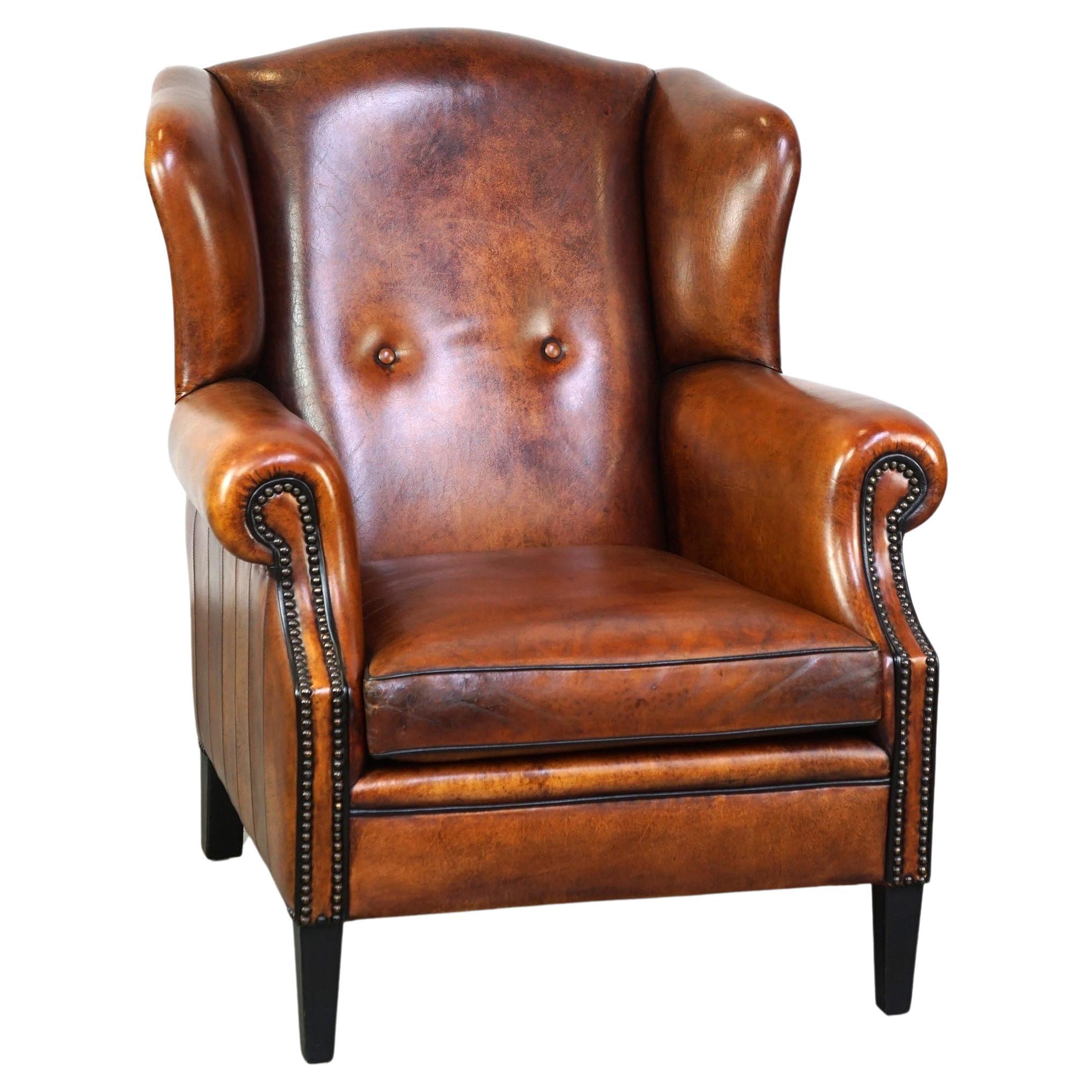 Beautiful and well-maintained sheep leather wingback chair, unique side ...
