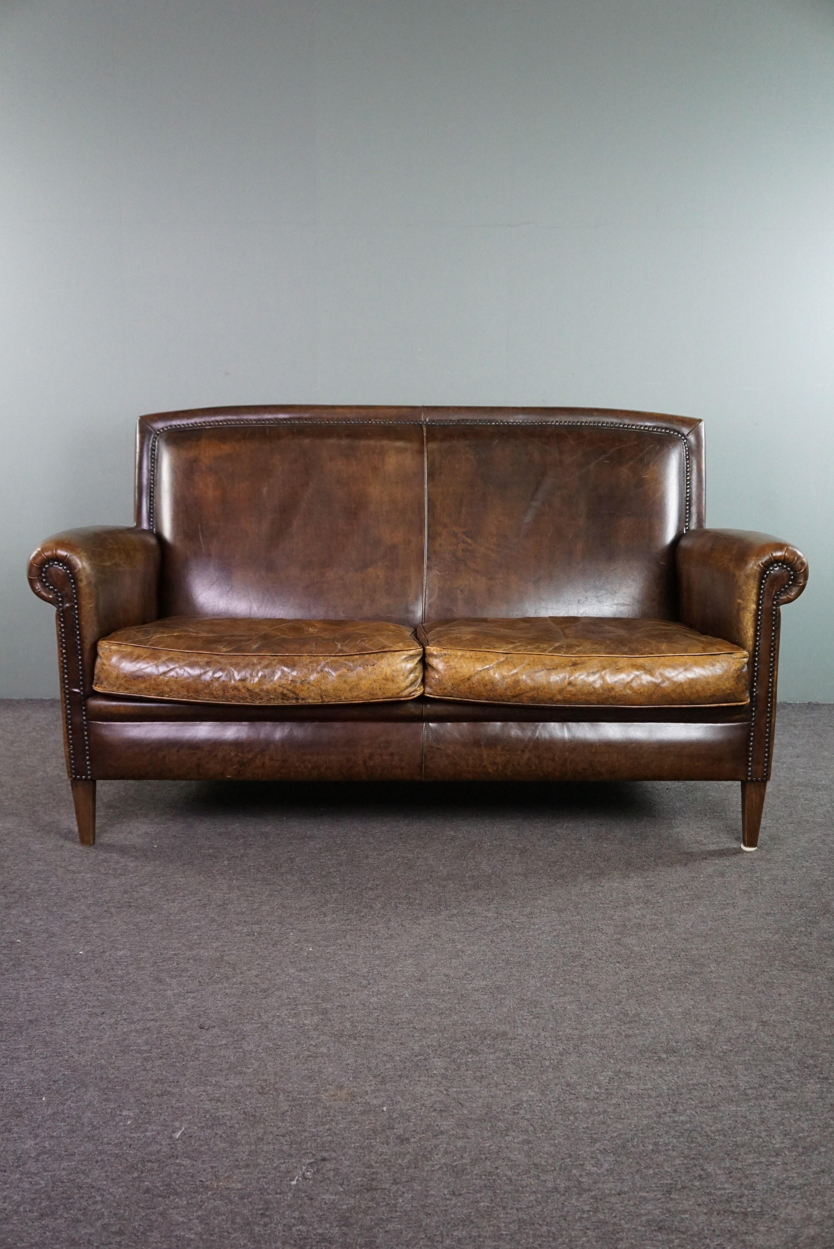 Beautiful dark cognac-colored cowhide 2-seater sofa in classic English ...