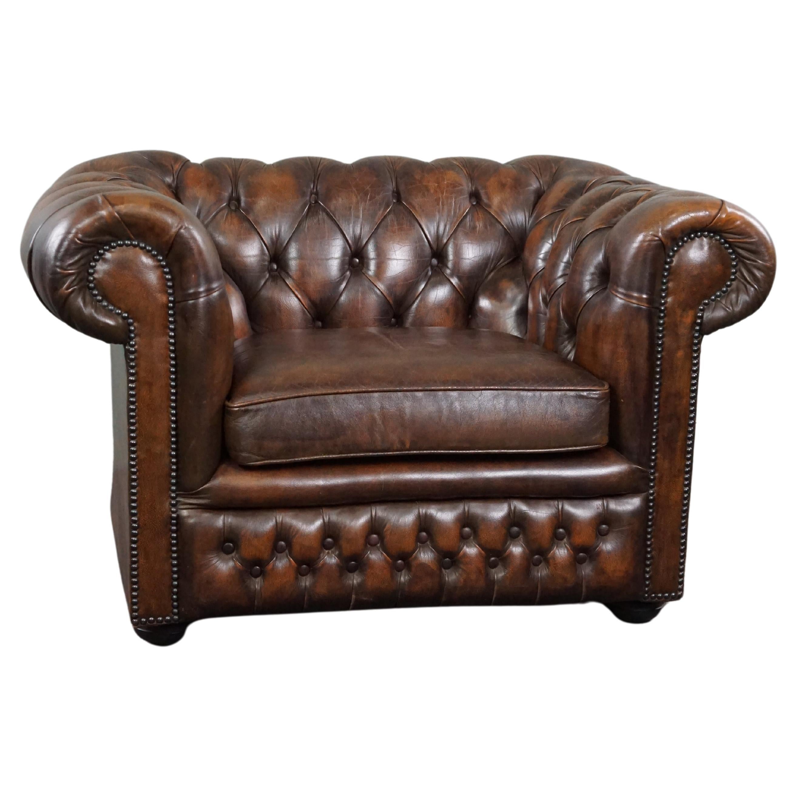 Beautifully colored spacious Chesterfield armchair For Sale at 1stDibs