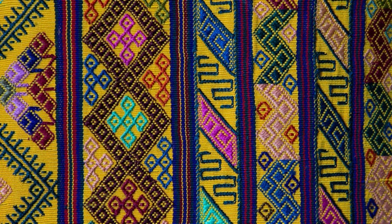 Bhutanese Silk Woven Kira Textile, Multicolor on Yellow For Sale at 1stDibs