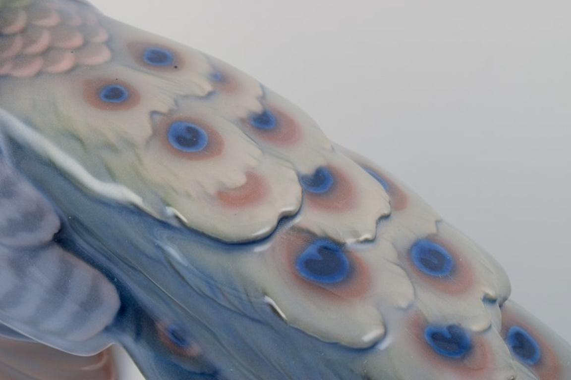 Bing and Grøndahl, large porcelain figurine of a peacock. From the ...
