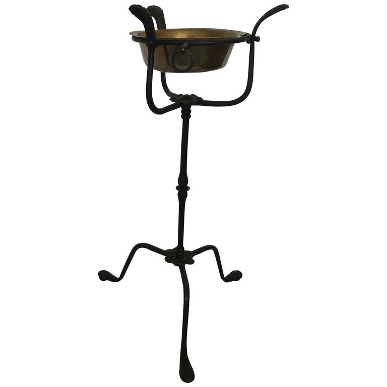 A wrought Iron Stand with a brass bowl , 17th Century For Sale at 1stDibs