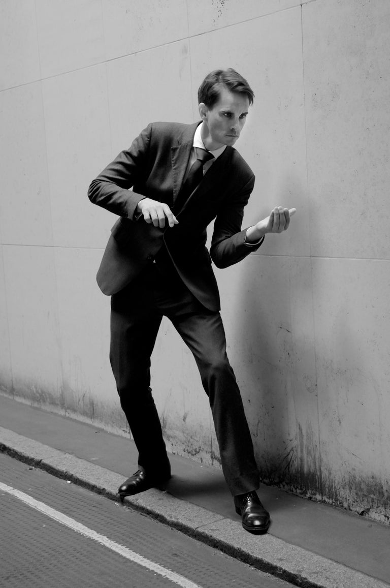 Brian Griffin - A portrait of a man in the suit posing with the ...