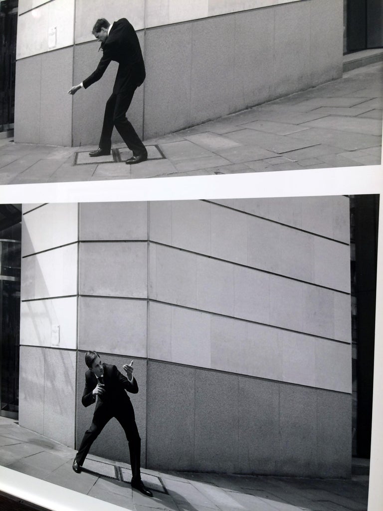 Brian Griffin - Take Up Arms by man in suit posing with the invisible ...