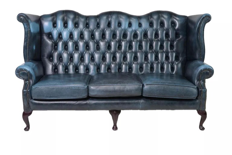 blue button back sofa