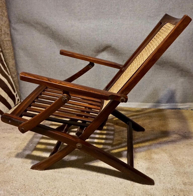 British Colonial Folding Campaign Chair with Cane Work and Bolts at 1stDibs
