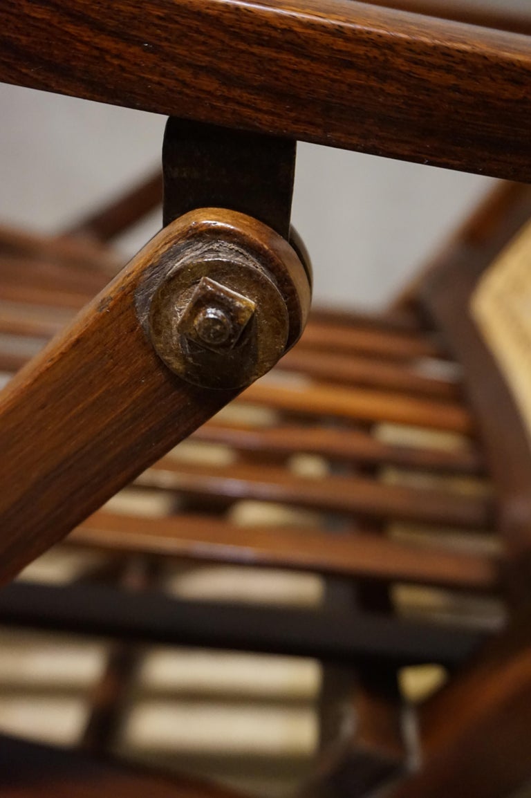 British Colonial Folding Campaign Chair with Cane Work and Bolts at 1stDibs